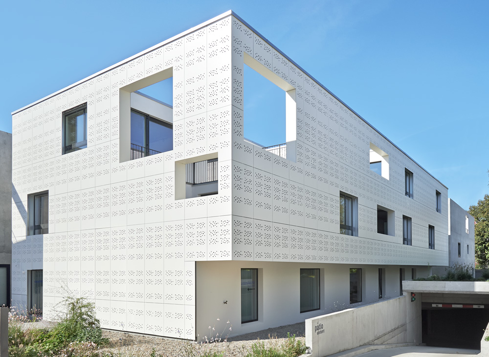 Gallery of Fiber Cement Cladding Panels in Patio Building - 2