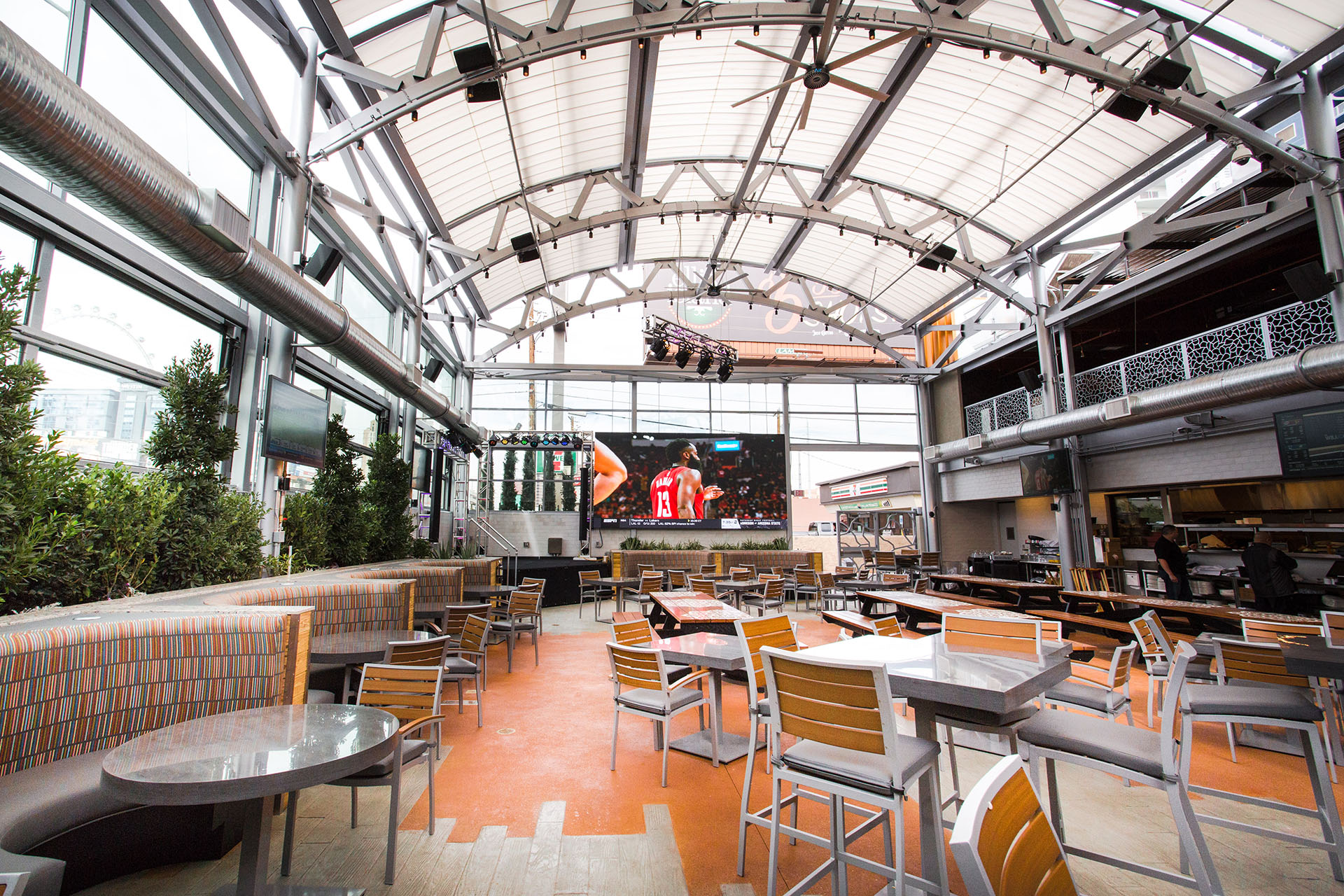 Arched Retractable Canopies - The Front Yard at Ellis Island from ShadeFX