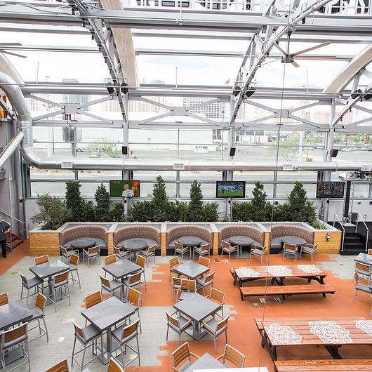 Arched Retractable Canopies - The Front Yard at Ellis Island from ShadeFX