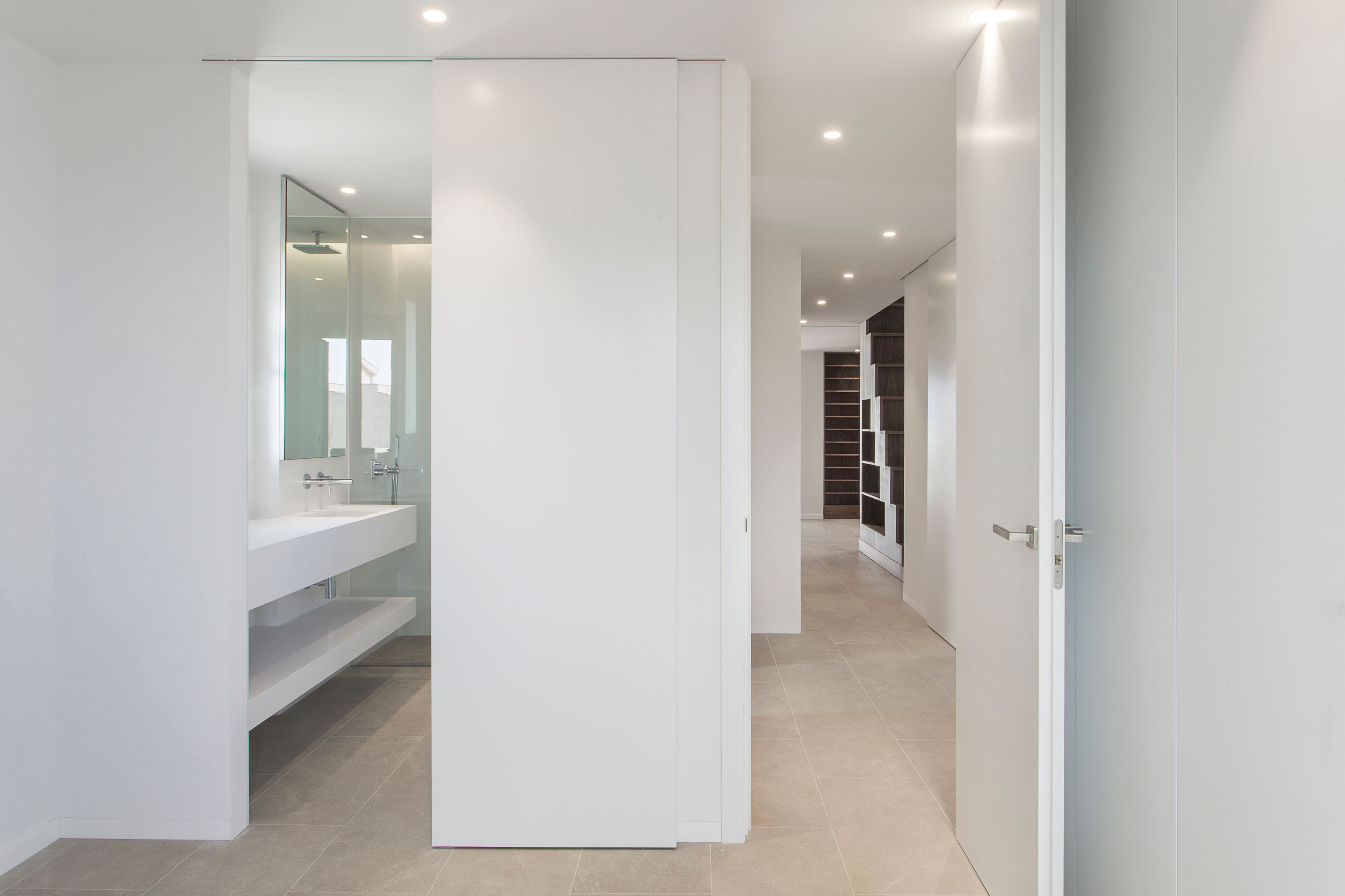 Gallery of Sliding Shelving Partitions in the Colonia House - 10