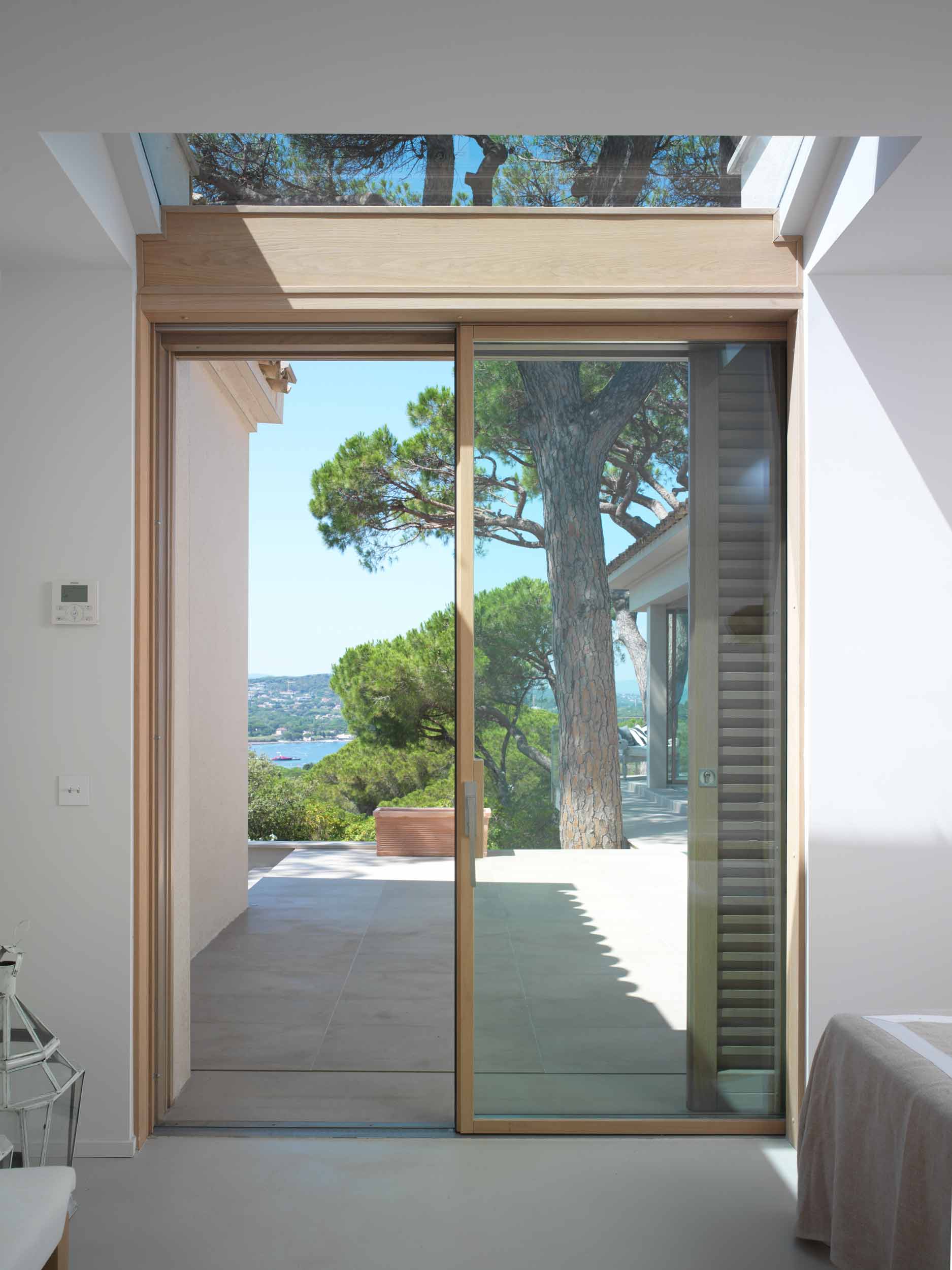Gallery of Lift & Slide Frameless Windows & Doors in a Villa - 10